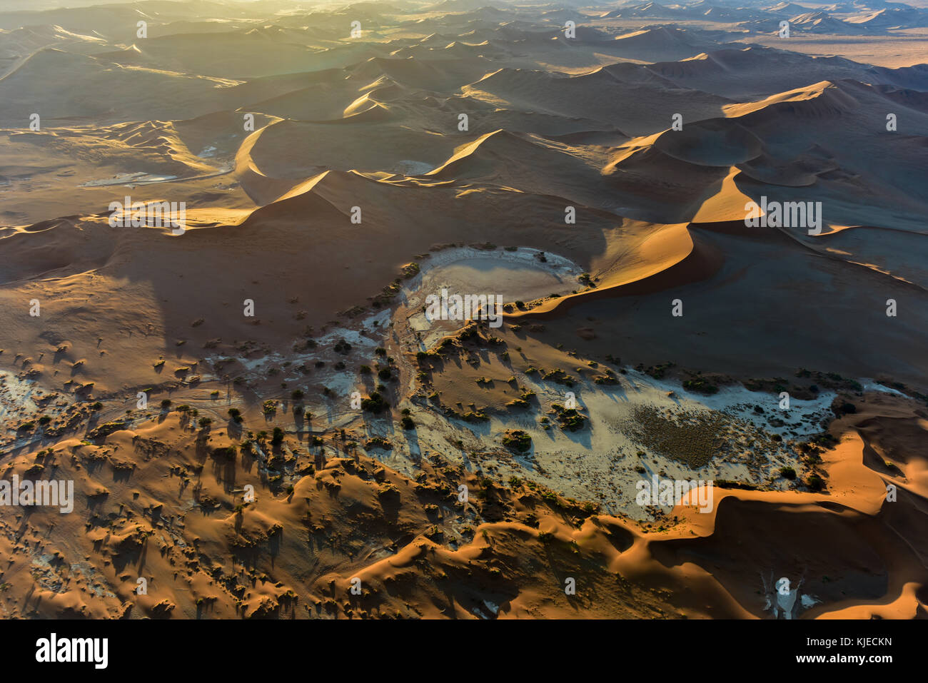 Aerial view of high red dunes, located in the Namib Desert, in the Namib-Naukluft National Park ...