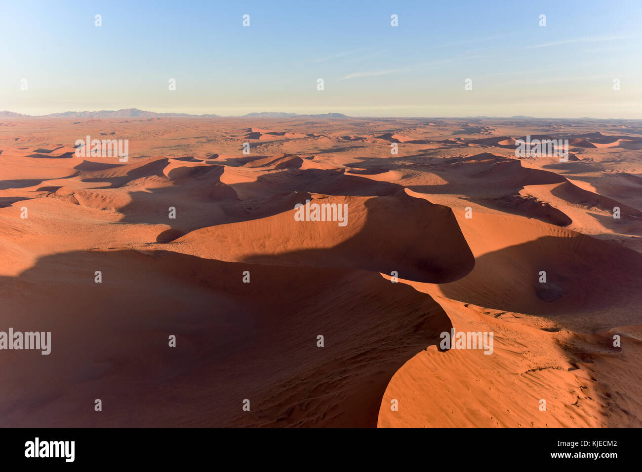 Aerial view of high red dunes, located in the Namib Desert, in the Namib-Naukluft National Park ...