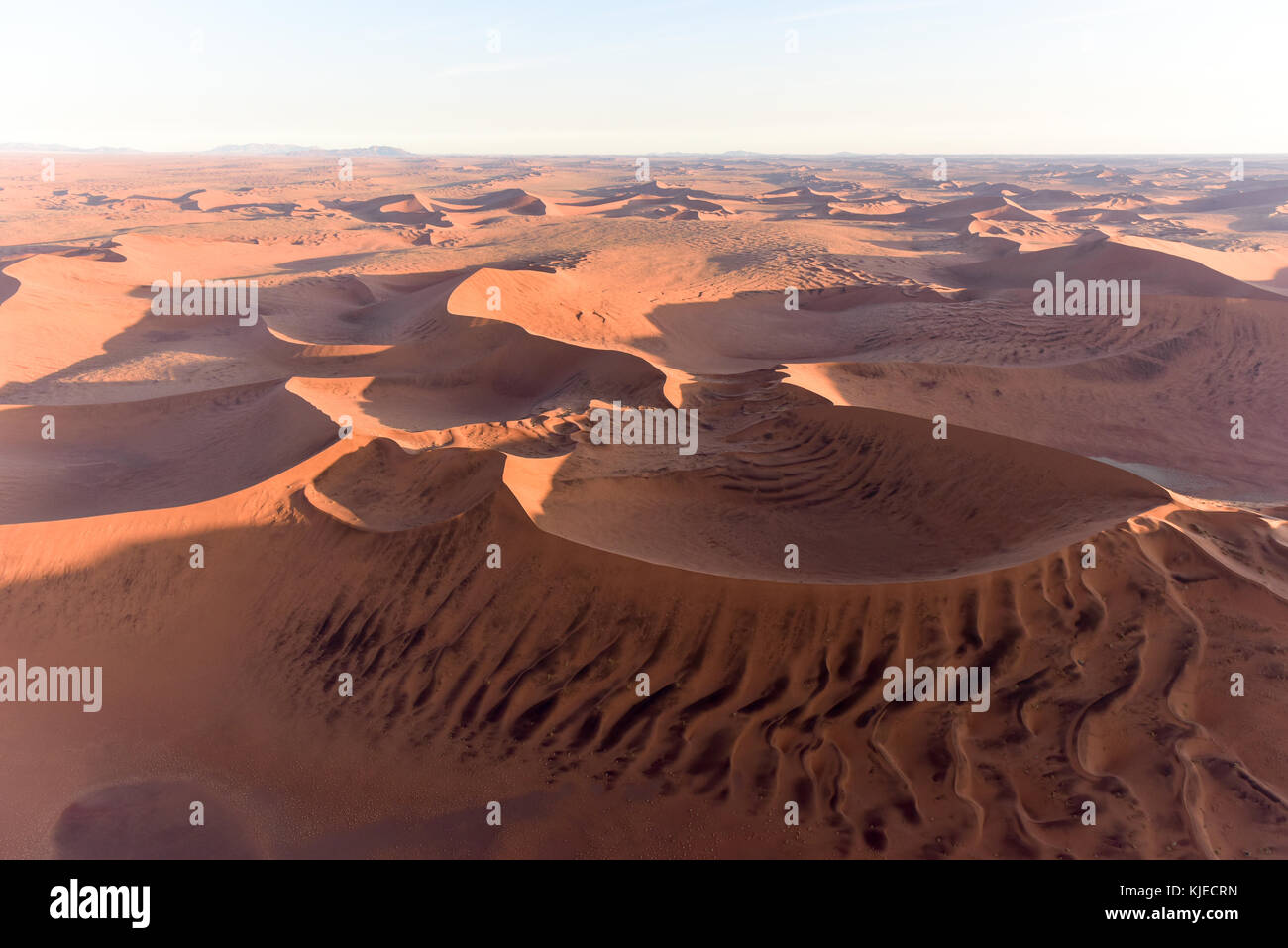 Aerial view of high red dunes, located in the Namib Desert, in the ...