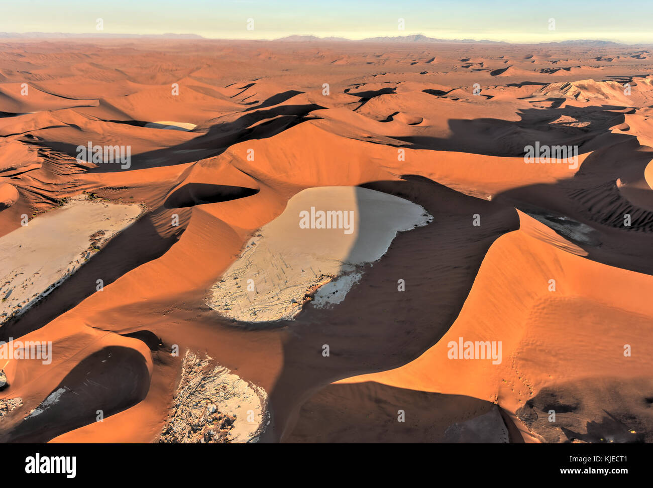 Aerial view of high red dunes, located in the Namib Desert, in the Namib-Naukluft National Park ...