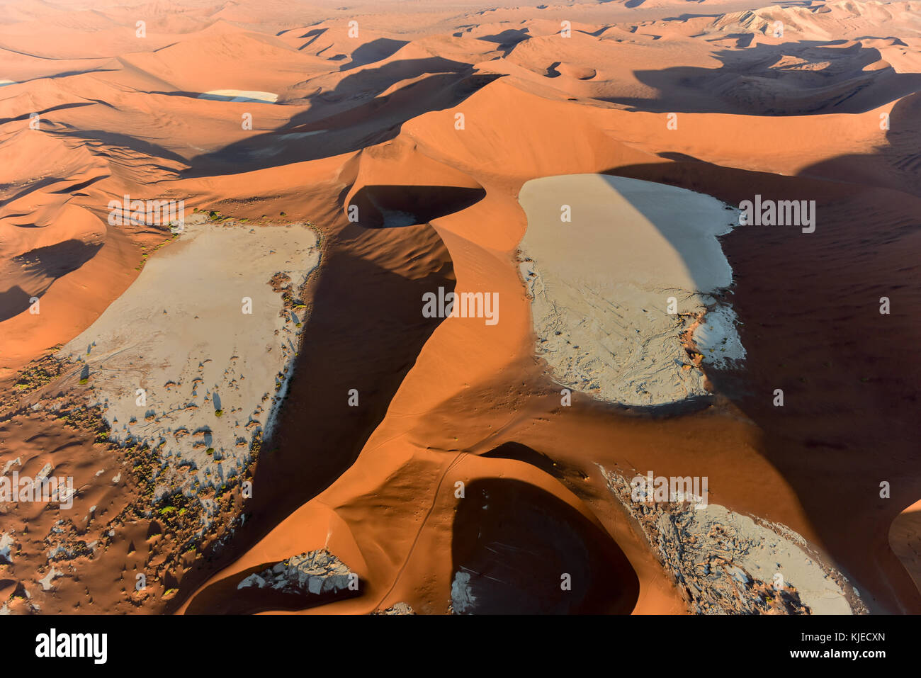 Aerial view of high red dunes, located in the Namib Desert, in the Namib-Naukluft National Park ...