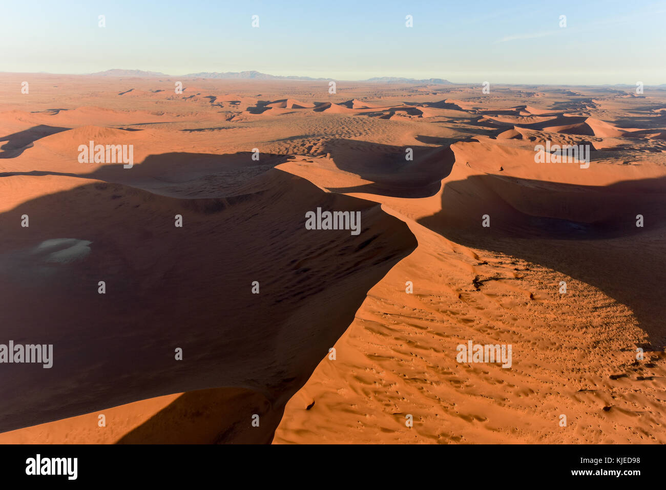 Aerial view of high red dunes, located in the Namib Desert, in the Namib-Naukluft National Park ...