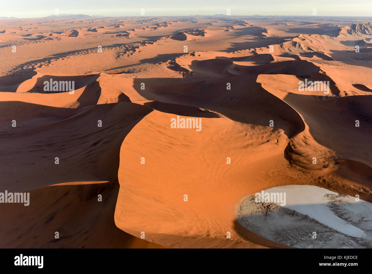 Aerial view of high red dunes, located in the Namib Desert, in the Namib-Naukluft National Park ...