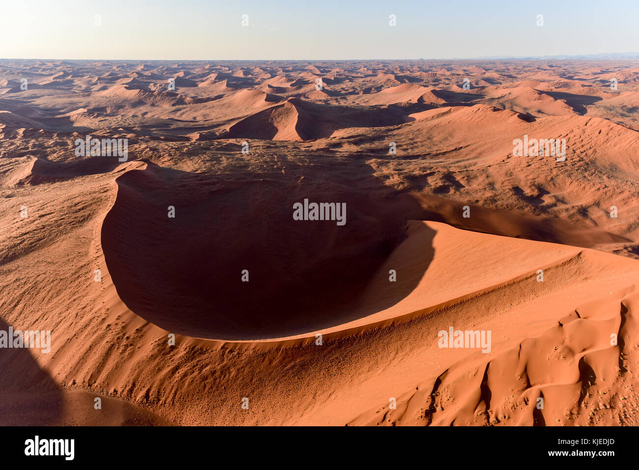 Aerial view of high red dunes, located in the Namib Desert, in the ...