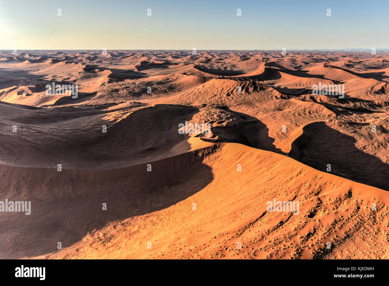 Aerial view of high red dunes, located in the Namib Desert, in the ...