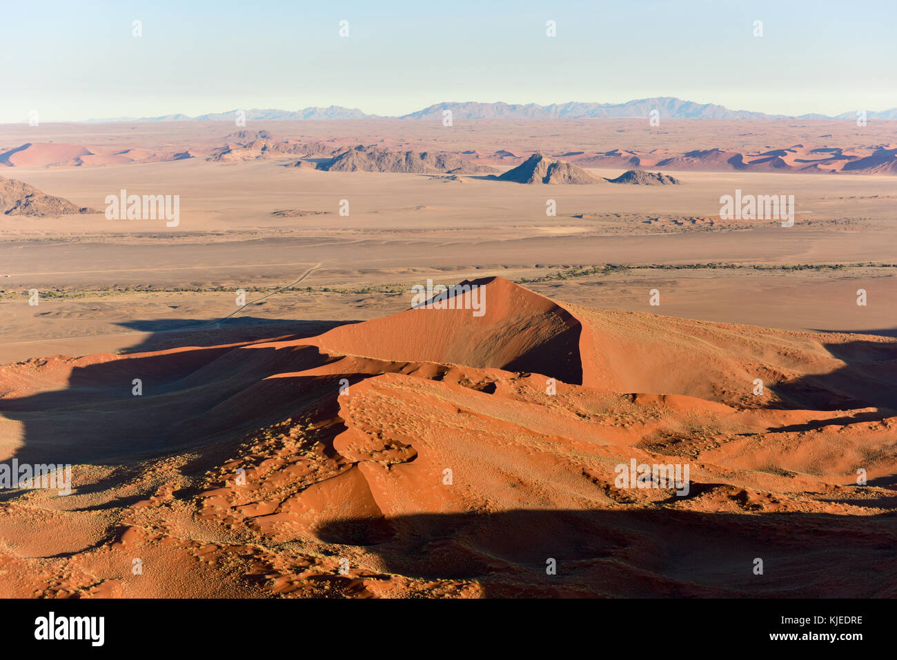 Aerial view of high red dunes, located in the Namib Desert, in the ...