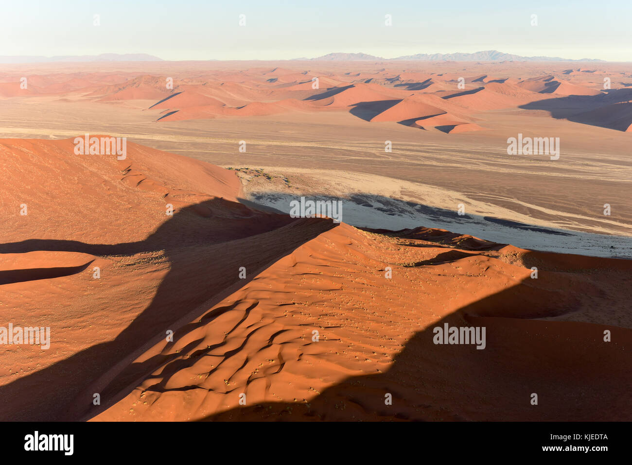 Aerial view of high red dunes, located in the Namib Desert, in the Namib-Naukluft National Park ...