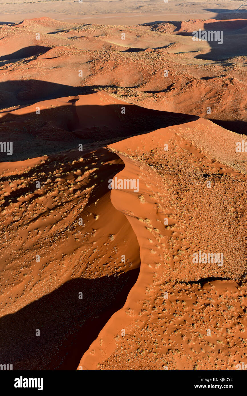 Aerial view of high red dunes, located in the Namib Desert, in the Namib-Naukluft National Park ...