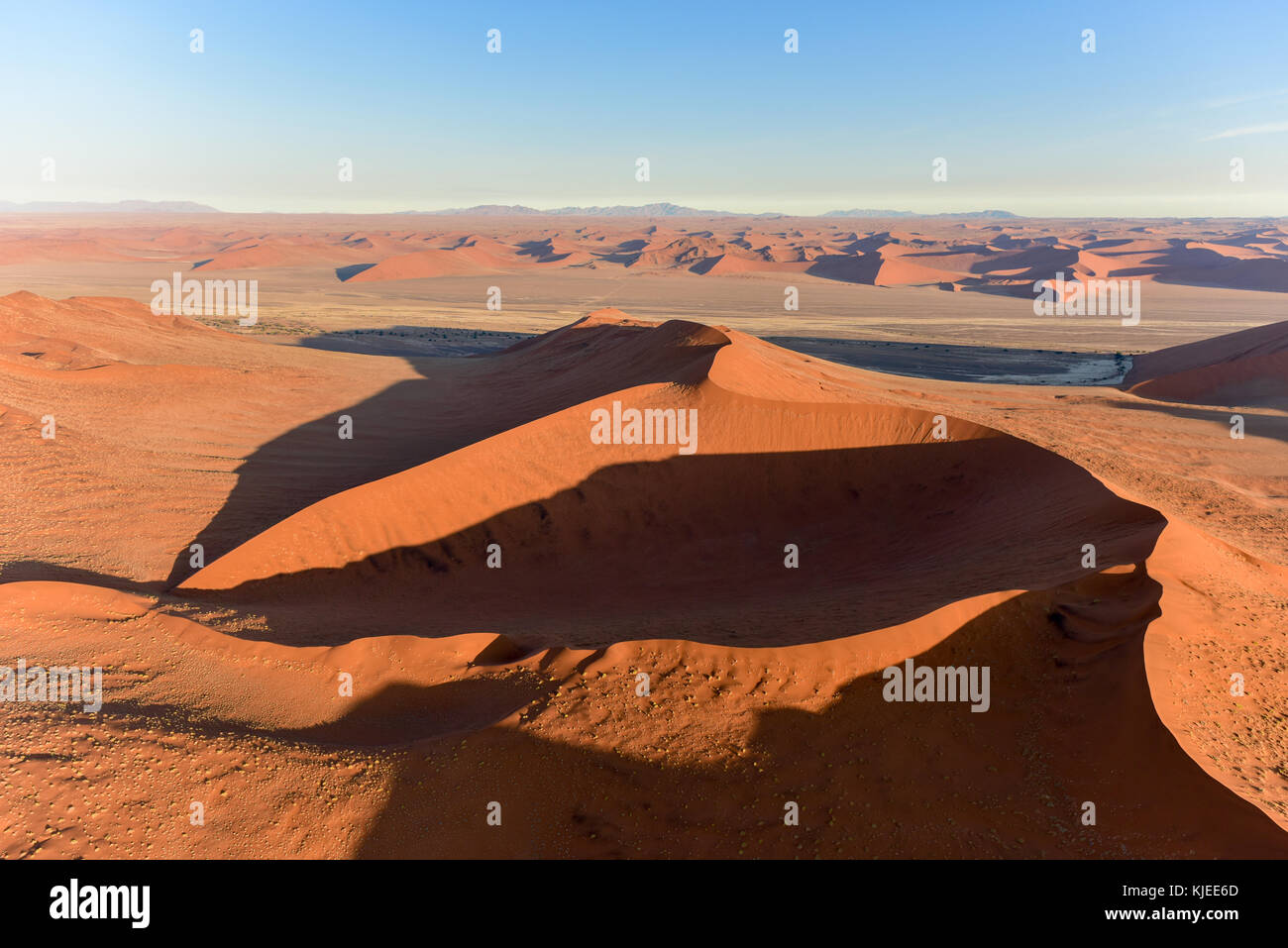 Aerial view of high red dunes, located in the Namib Desert, in the Namib-Naukluft National Park ...