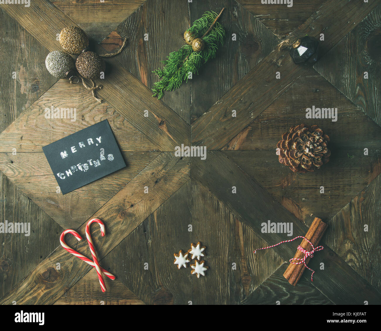Flat-lay of greeting card, cinnamon, candy cane, top view Stock Photo ...