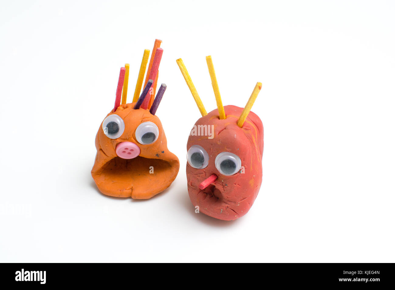 fun modelling clay figures with shocked expression on isolated white ...