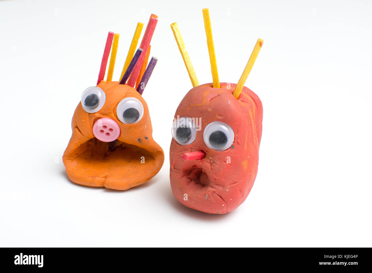 fun modelling clay figures with shocked expression on isolated white ...