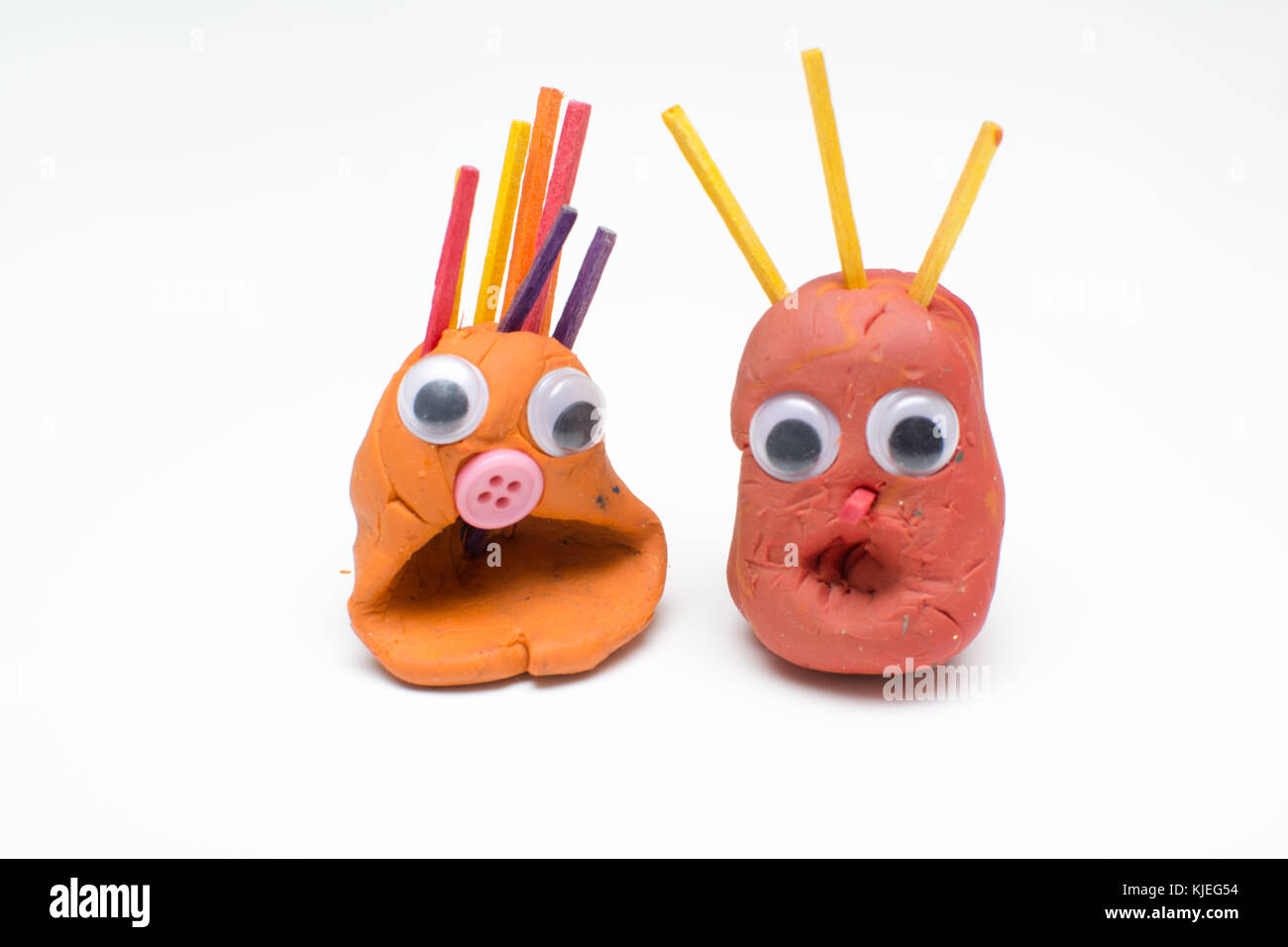 fun modelling clay figures with shocked expression on isolated white ...