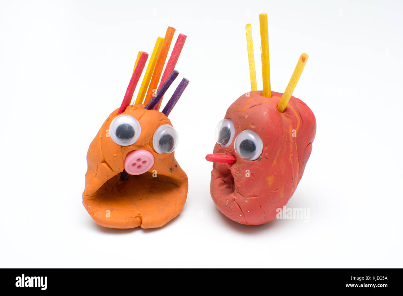 fun modelling clay figures with shocked expression on isolated white ...