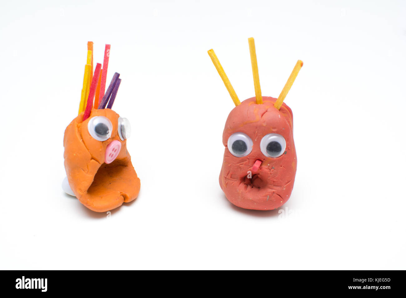 fun modelling clay figures with shocked expression on isolated white ...