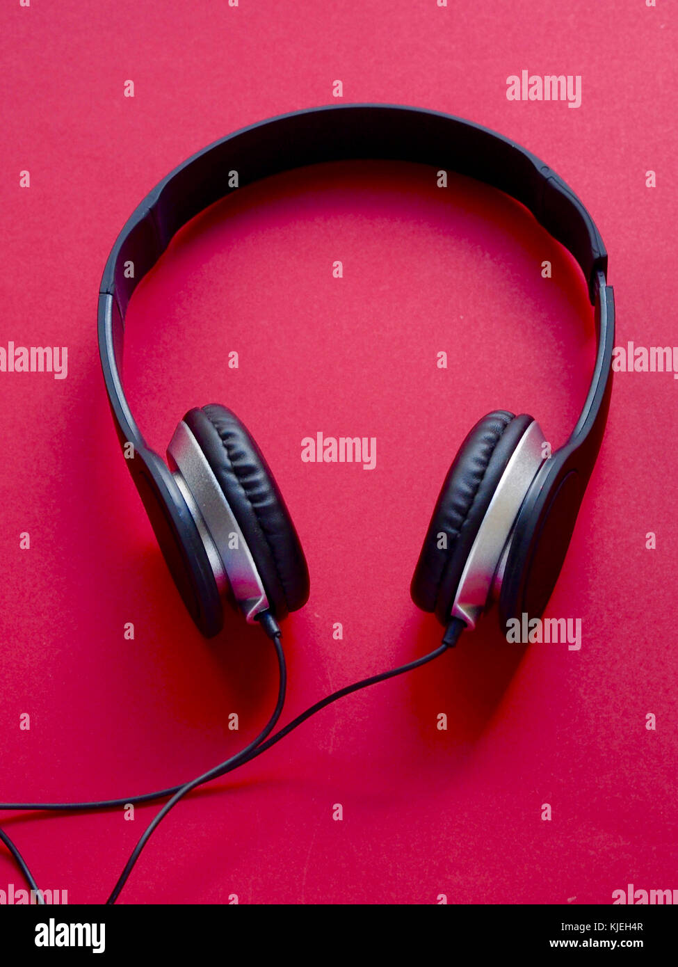 Headphone on red background Stock Photo - Alamy