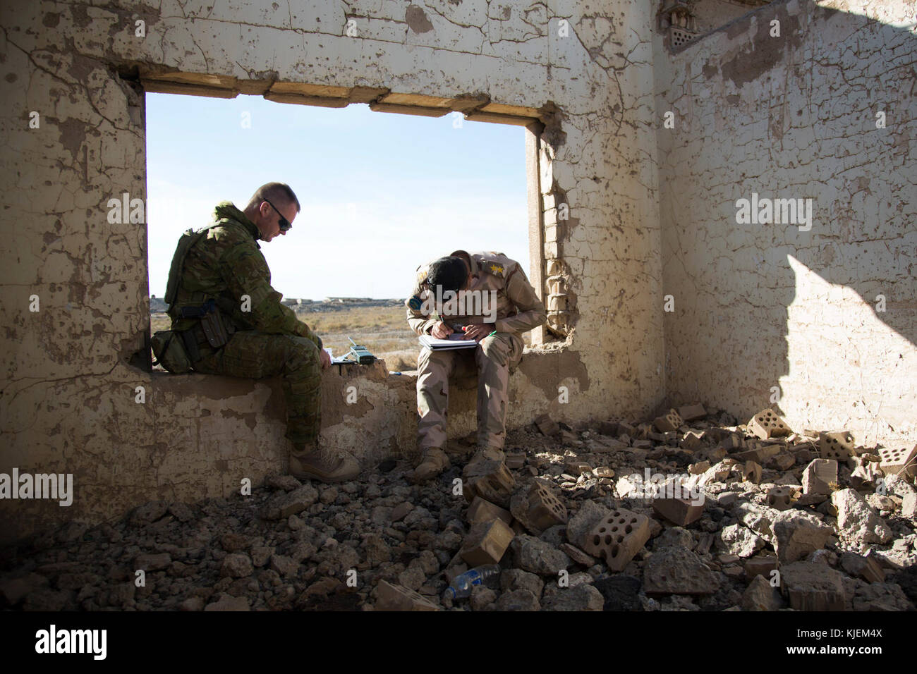 Australian trainer Sgt. Dave Devlin, (Left), assigned to the 4th ...