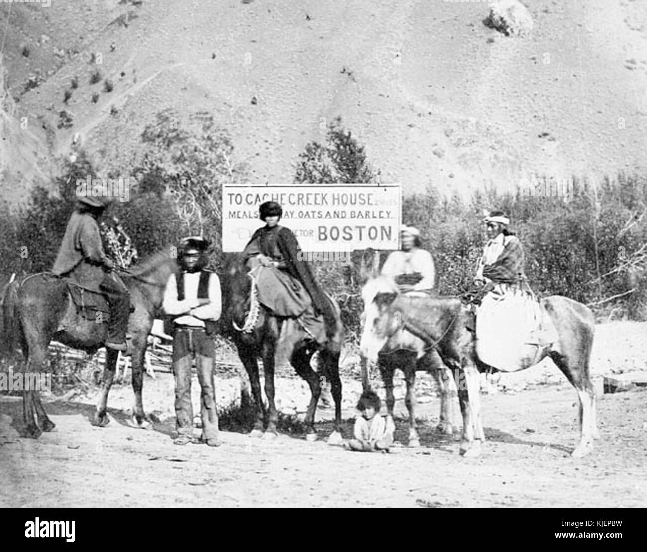 This historical photograph captures the Cariboo Road, a key ...