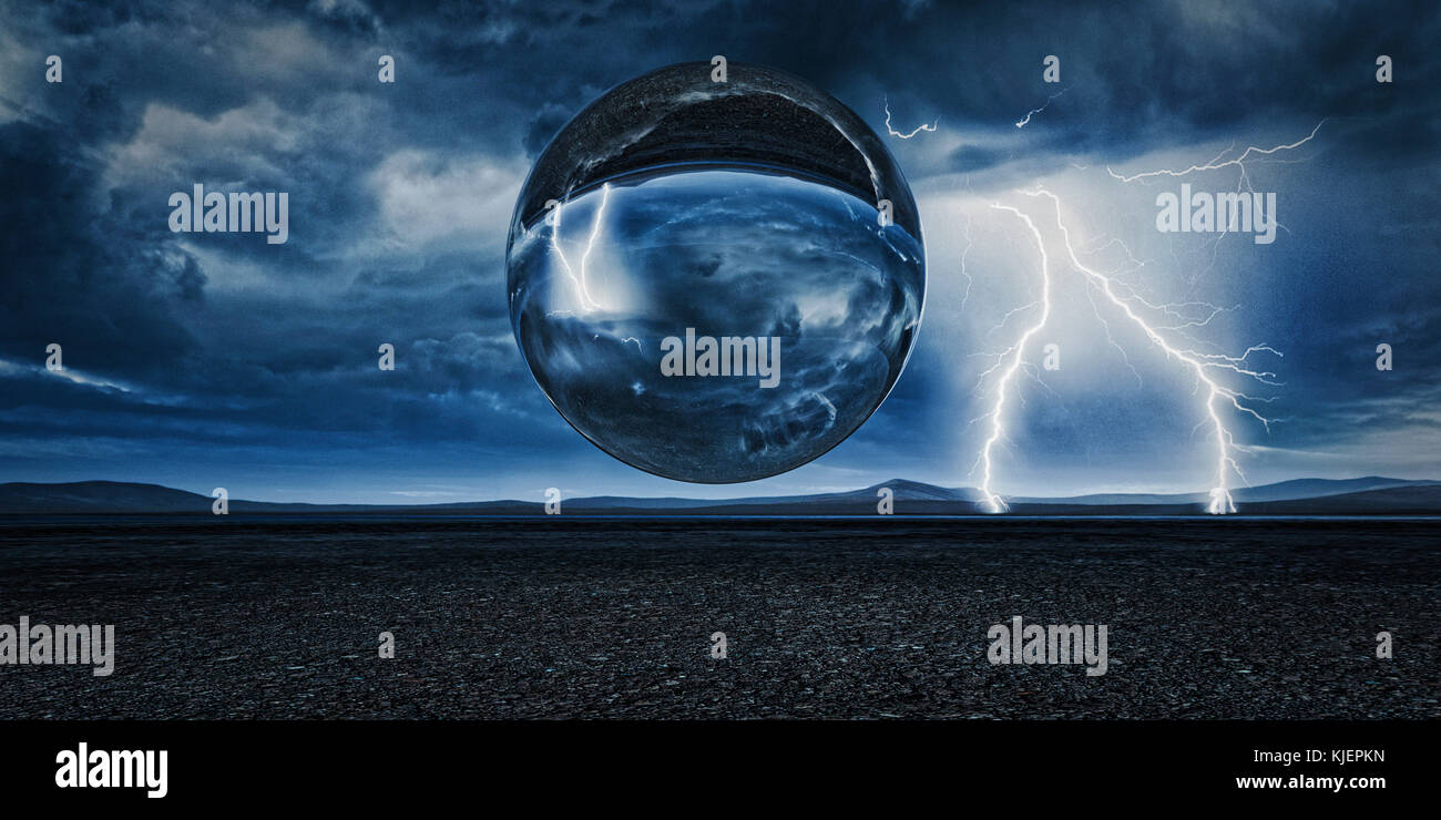 Sphere floating in remote landscape Stock Photo - Alamy
