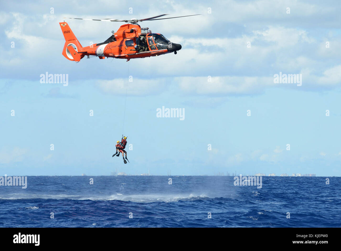 Crewmembers from Coast Guard Air Station Barbers Point conduct hoisting ...