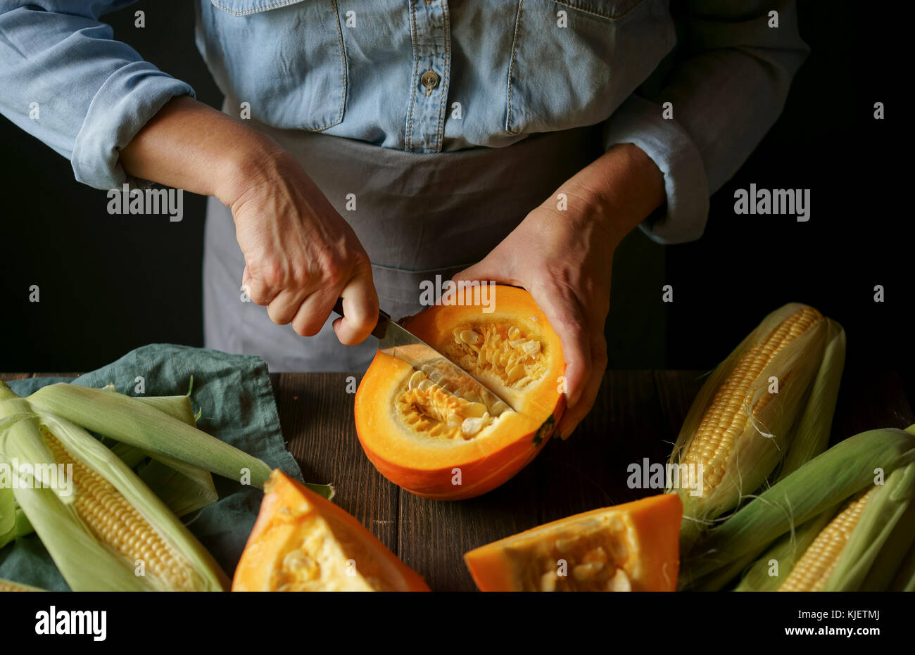 Close up of Caucasian woman cutting squash Stock Photo - Alamy