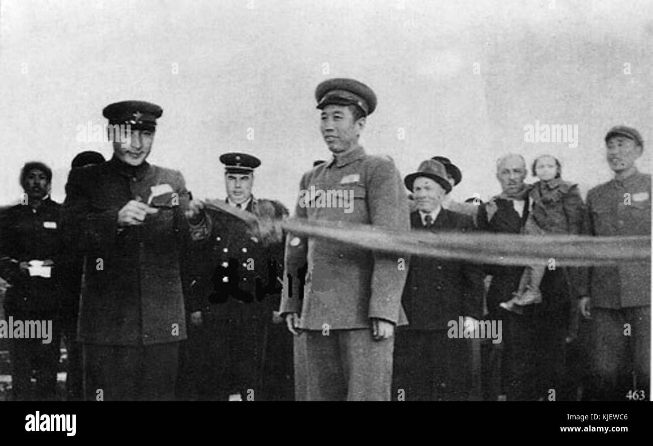 Wang Zhen and Saifuddin Azizi cut the ribbon for the October tractor ...