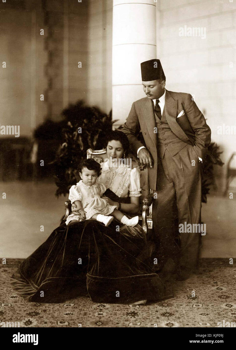 This photograph captures Farouk I of Egypt with his family, offering a ...