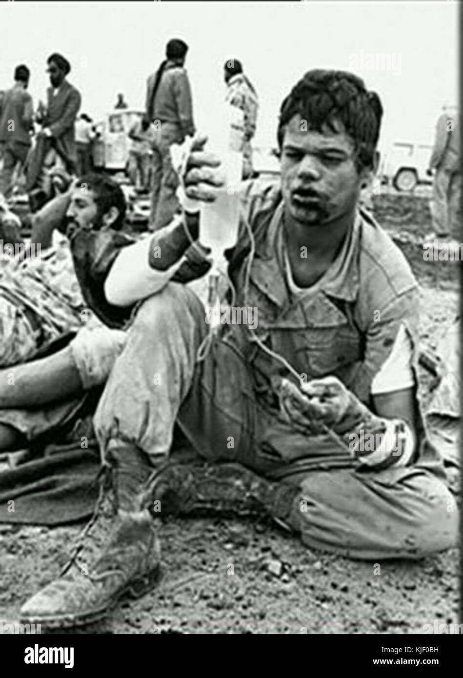Iranian soldier holding IV bag during Iran Iraq war Stock Photo - Alamy