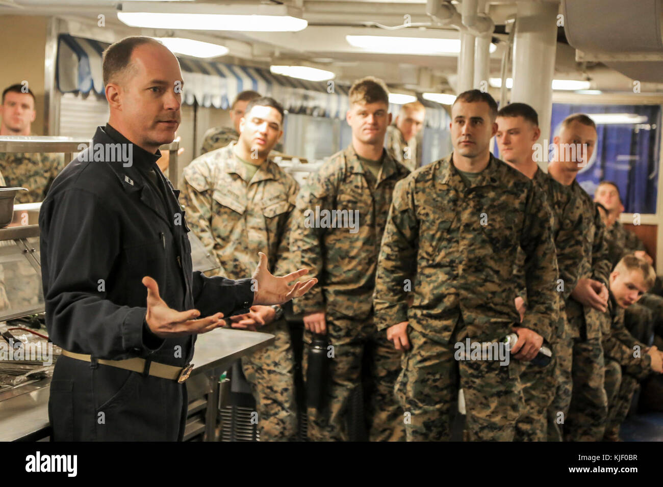 U.S. Navy Lt. Gregory Woodard, left, the command chaplain for the dock ...