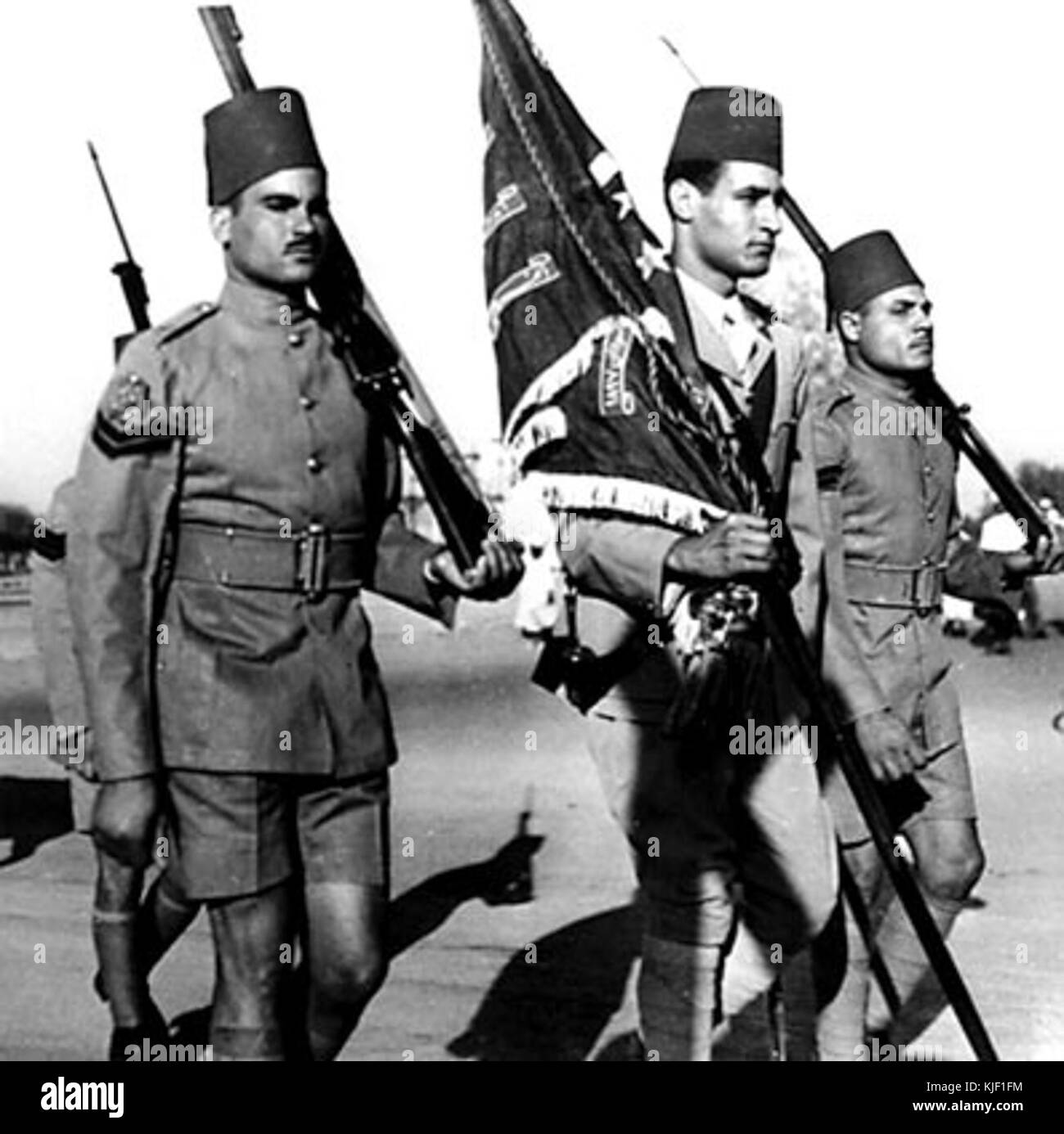 Nasser carrying the battalion flag 10009 Stock Photo - Alamy