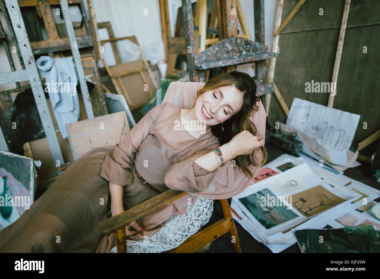 Smiling Caucasian woman laying in chair Stock Photo - Alamy