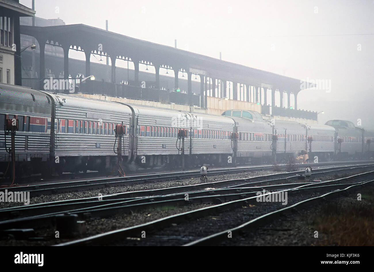 This set of three photos from December 1980 depicts two Amtrak trains ...