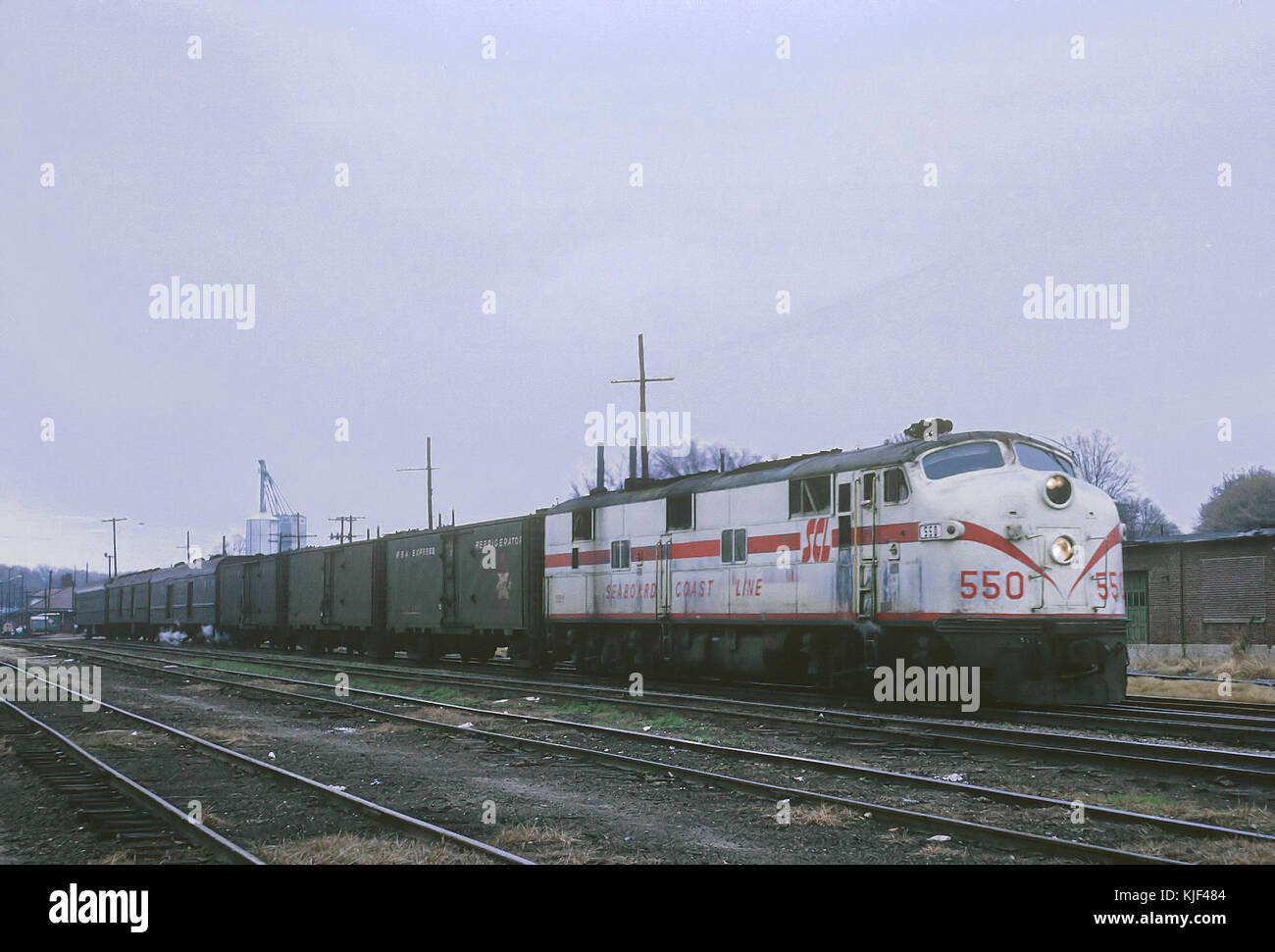This photograph captures the SCL E7A 550 locomotive pulling Train 5 ...