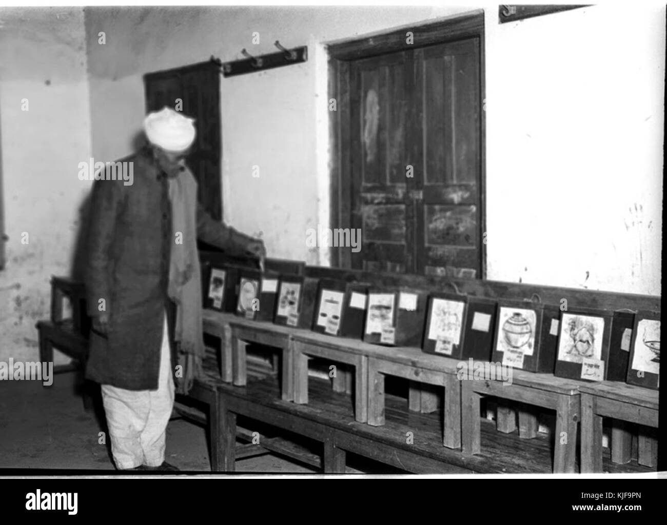 An Indian villager casting his vote for the 1952 general elections ...