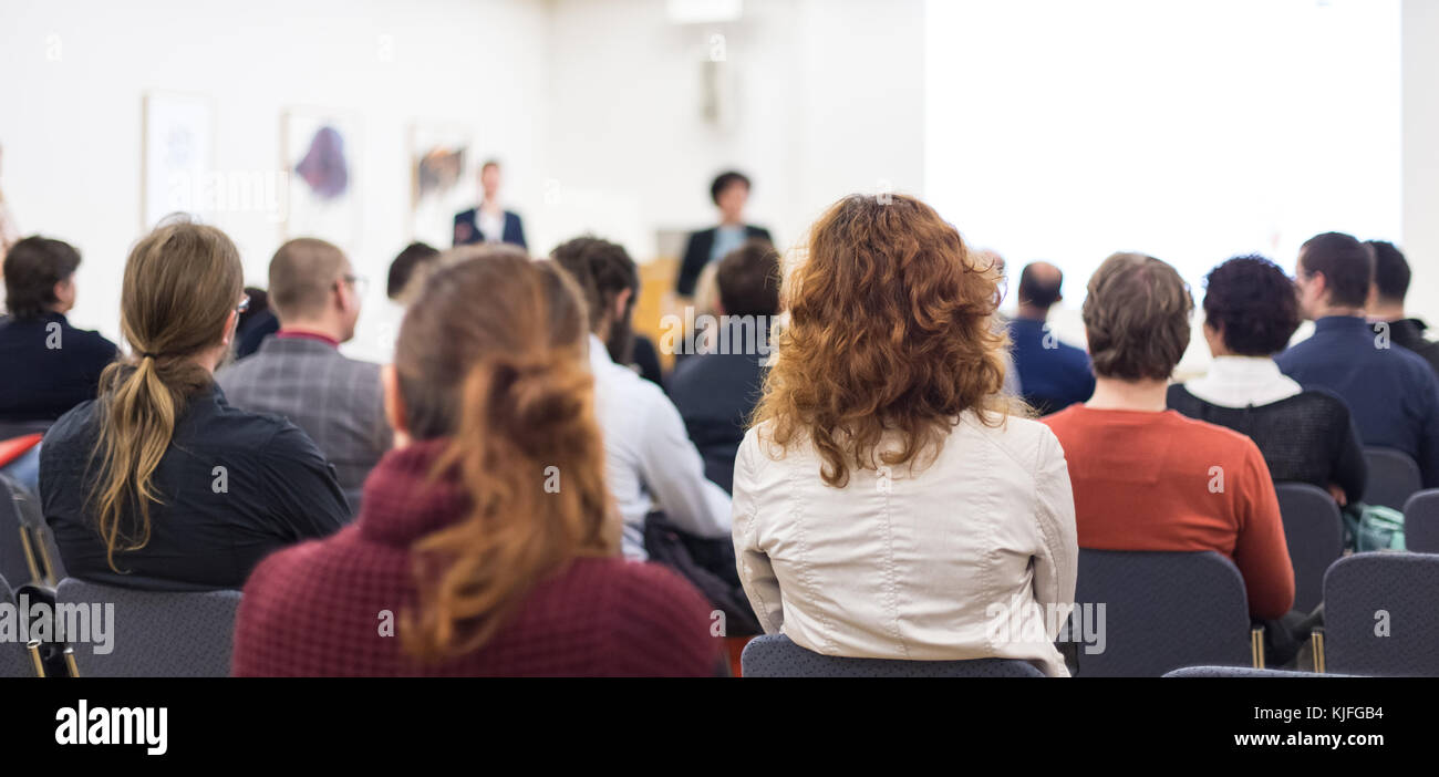 Woman giving presentation on business conference Stock Photo - Alamy
