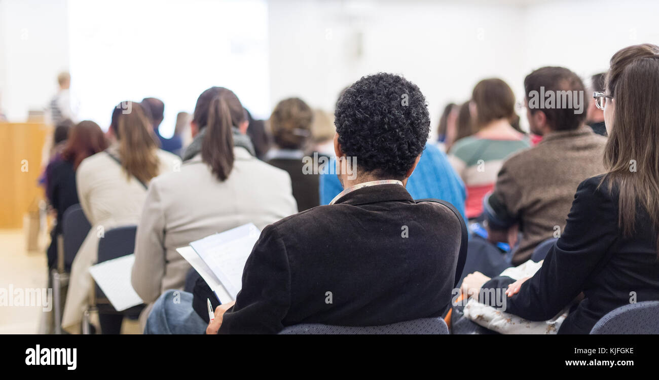Woman giving presentation on business conference Stock Photo - Alamy