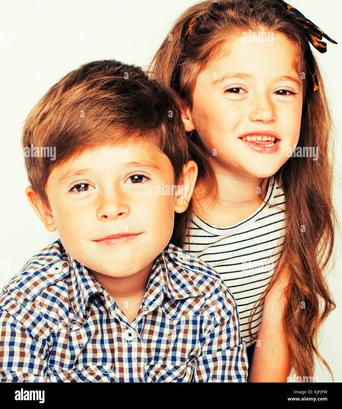 little cute boy and girl hugging playing on white background, ha Stock Photo - Alamy