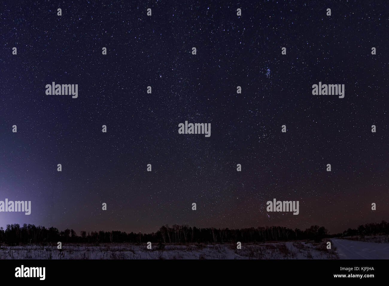 Horizontal panorama of the night sky with stars against the dark winter ...