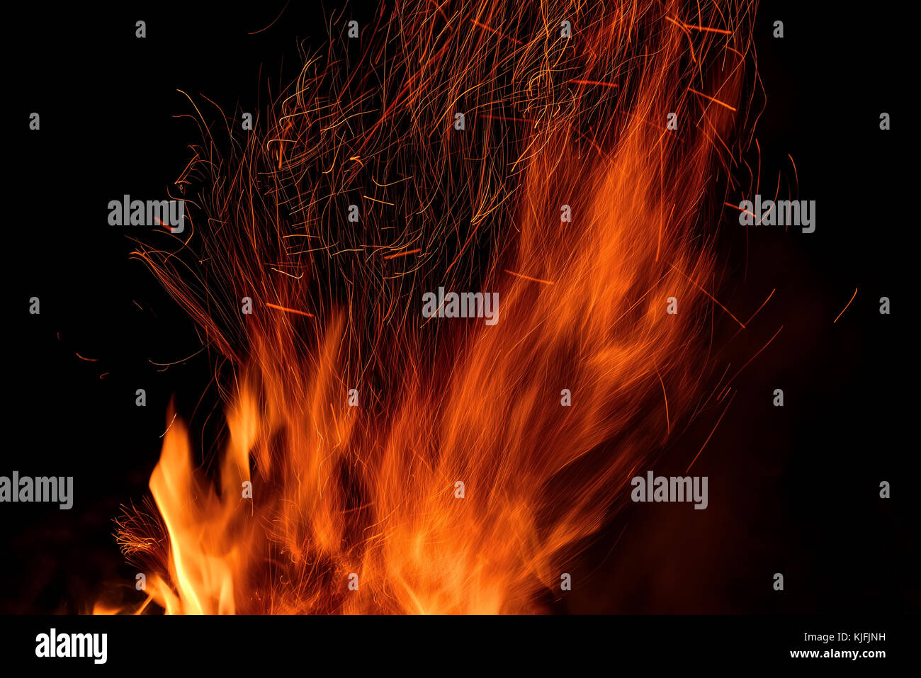 Red and orange fire background of flame and sparks from the bonfire in ...