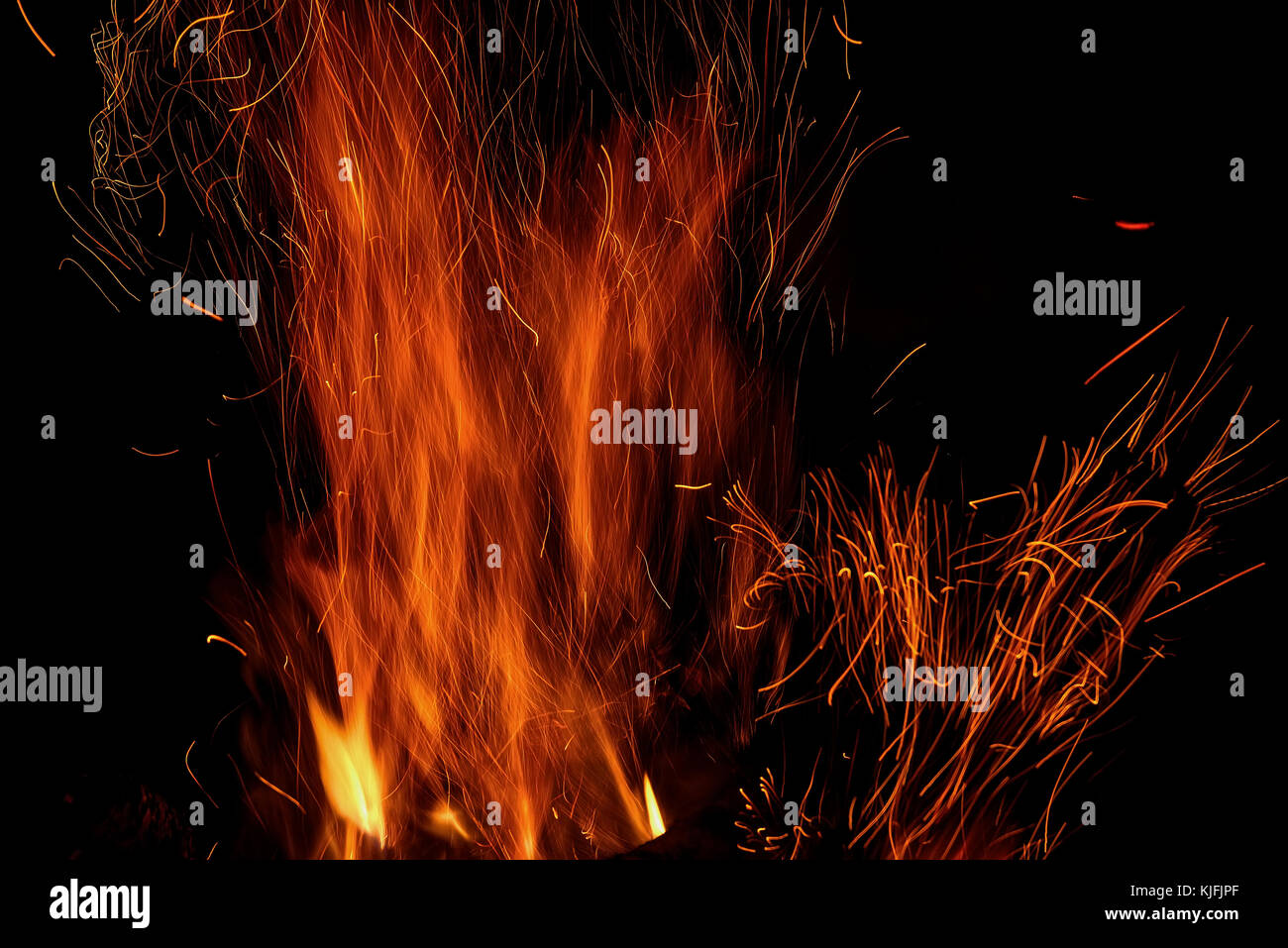 Red and orange fire background of flame and sparks from the bonfire in ...