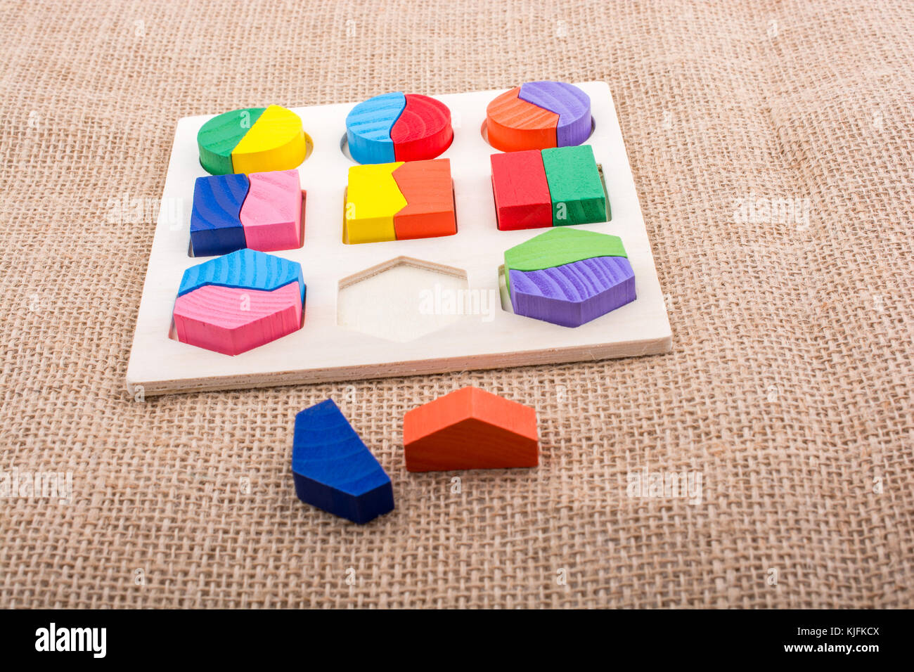 Colorful wooden pieces of a logic puzzle Stock Photo - Alamy