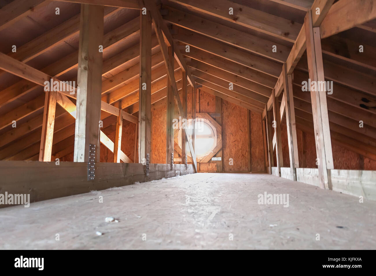 Attic with wooden beams inside a new house under construction Stock ...