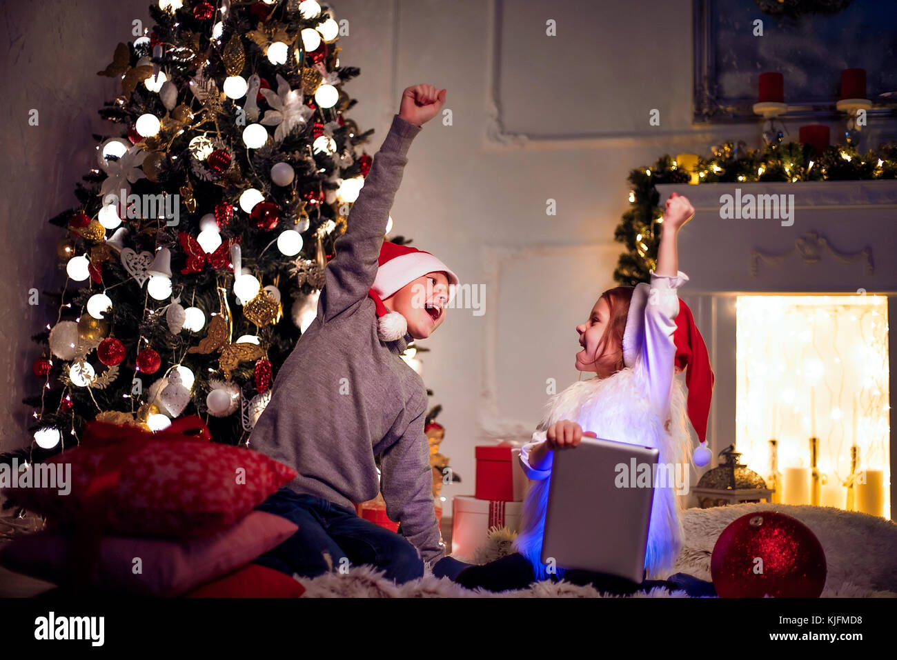 Charming girl sitting near fireplace hi-res stock photography and ...
