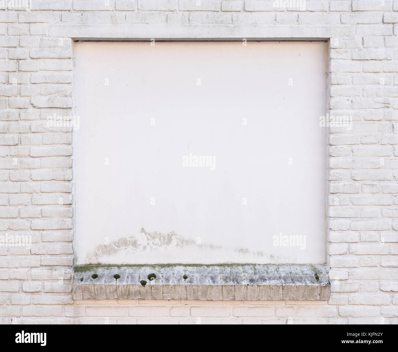 white painted brick wall with blind window Stock Photo - Alamy