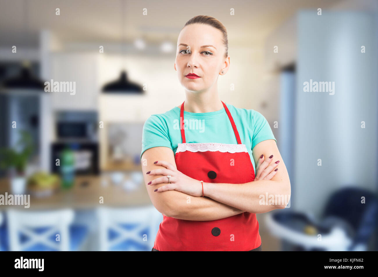 Proud maid, housewife or housekeeper standing arms crossed on clean ...