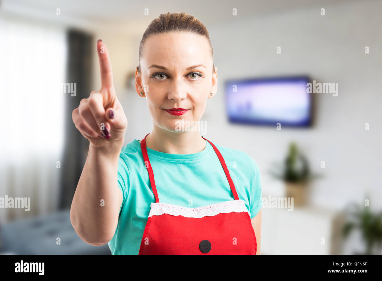 Maid or housekeeper touching invisible transparent screen display on ...
