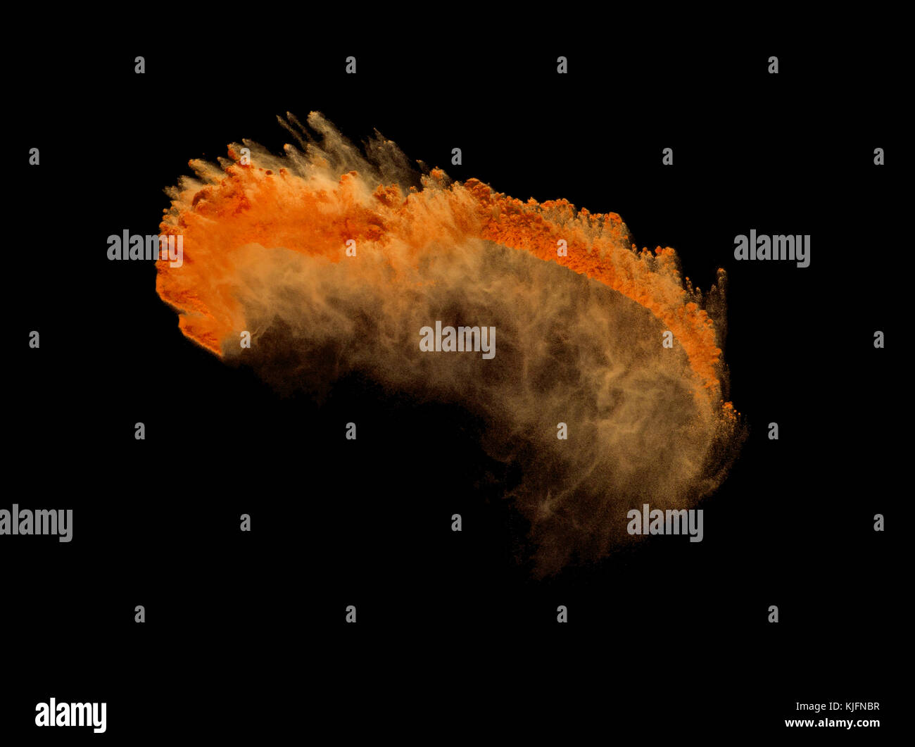 Orange powder splash isolated on black background Stock Photo - Alamy
