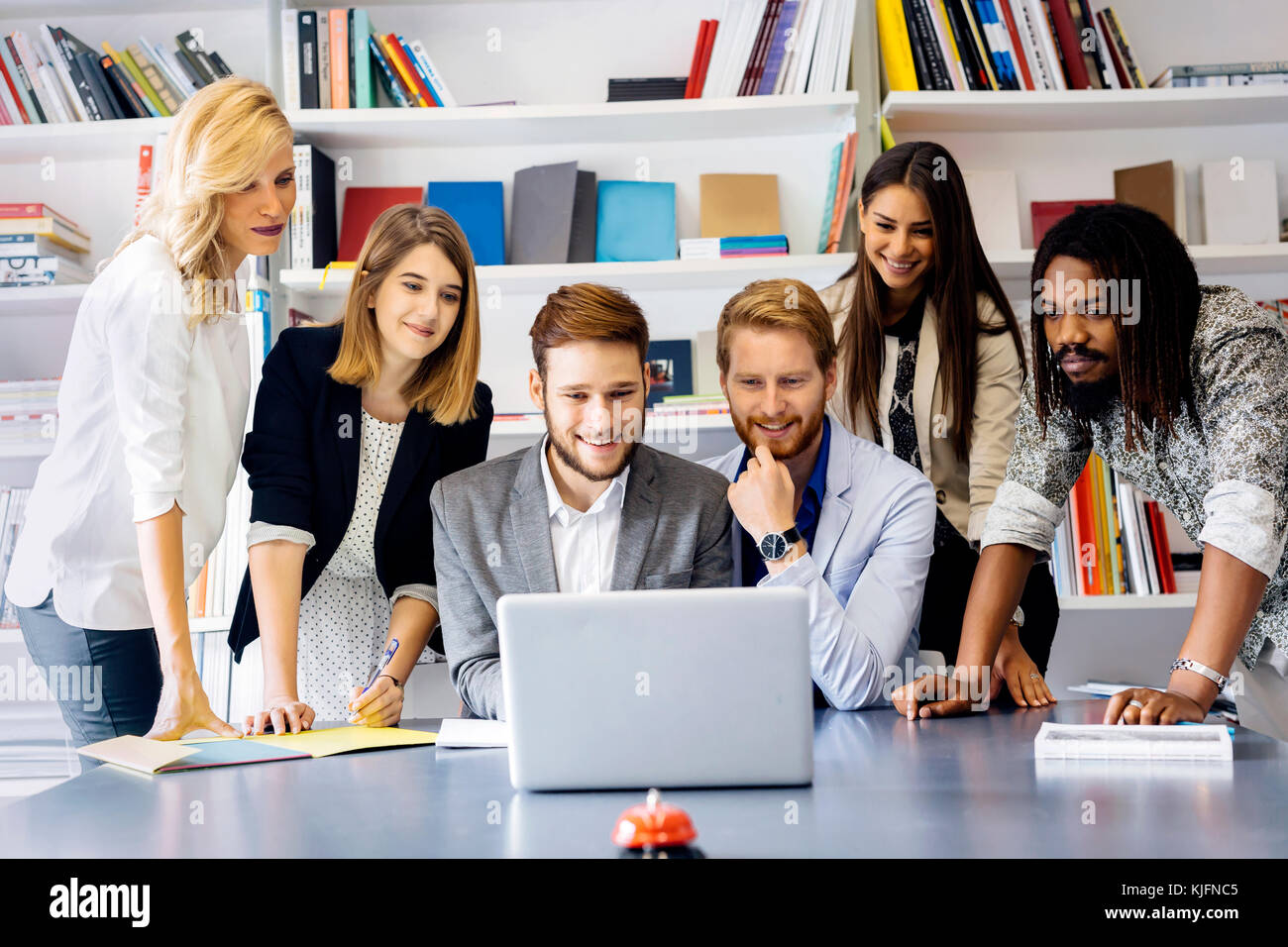 Group of designers discussing trends Stock Photo - Alamy
