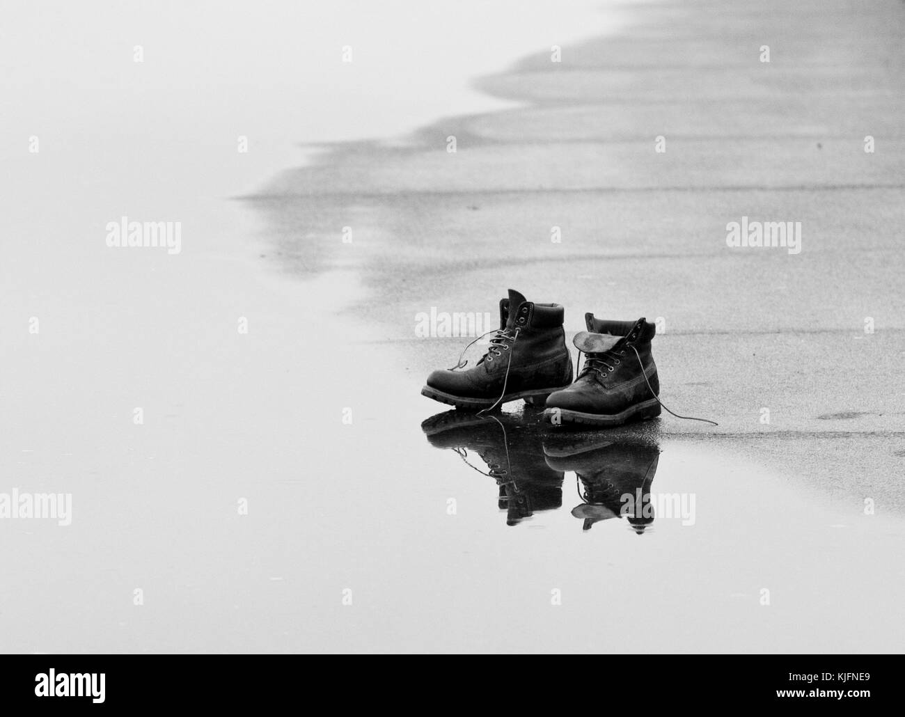 Shoes in puddle hi-res stock photography and images - Alamy