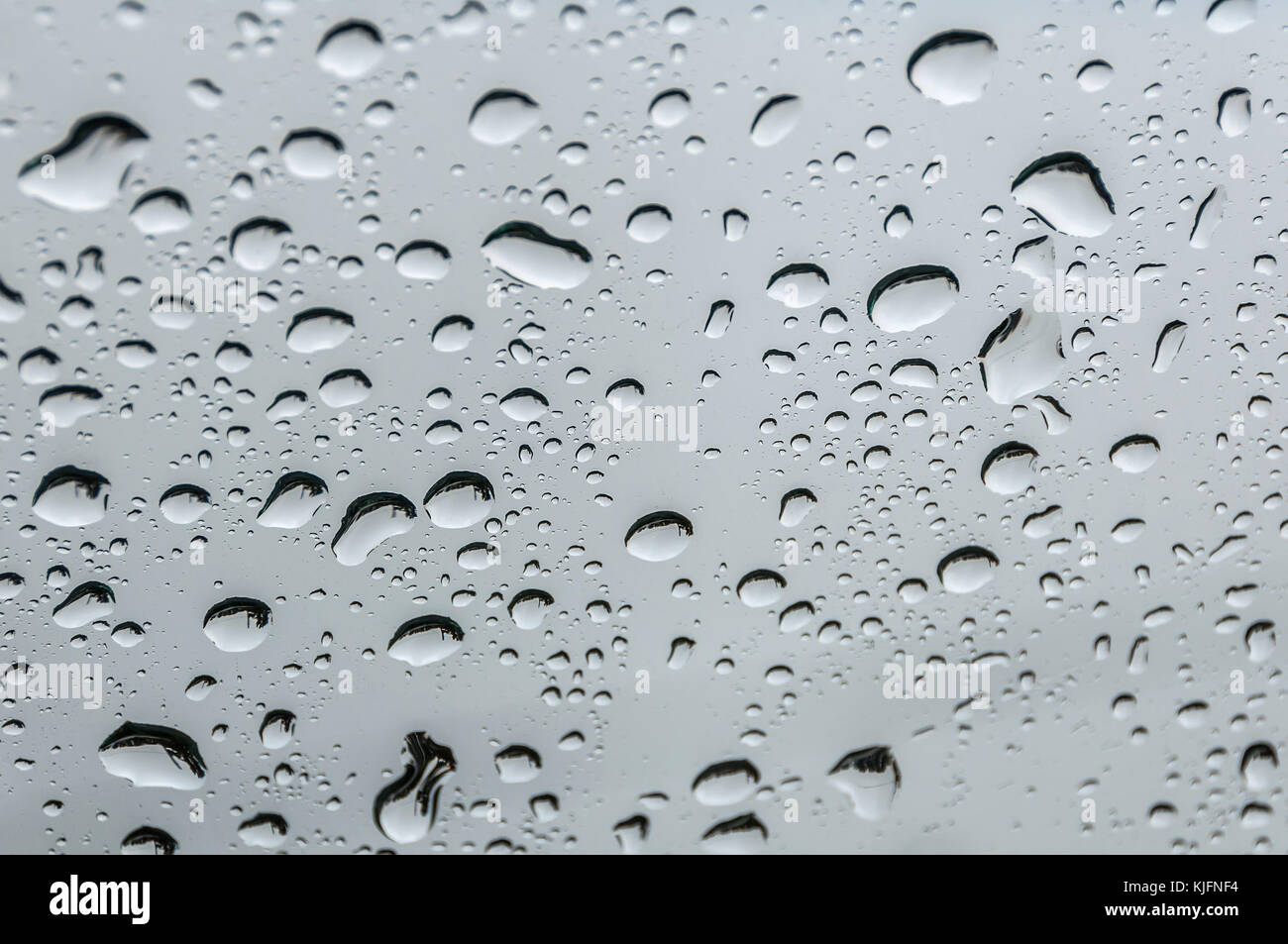 Raindrops on the windshield of a car closeup Stock Photo - Alamy